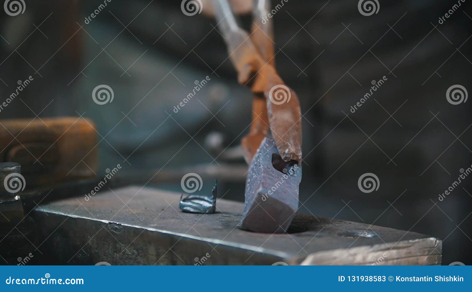 Blacksmith Working with Hammer on the Anvil, Man Taking Workpiece of ...