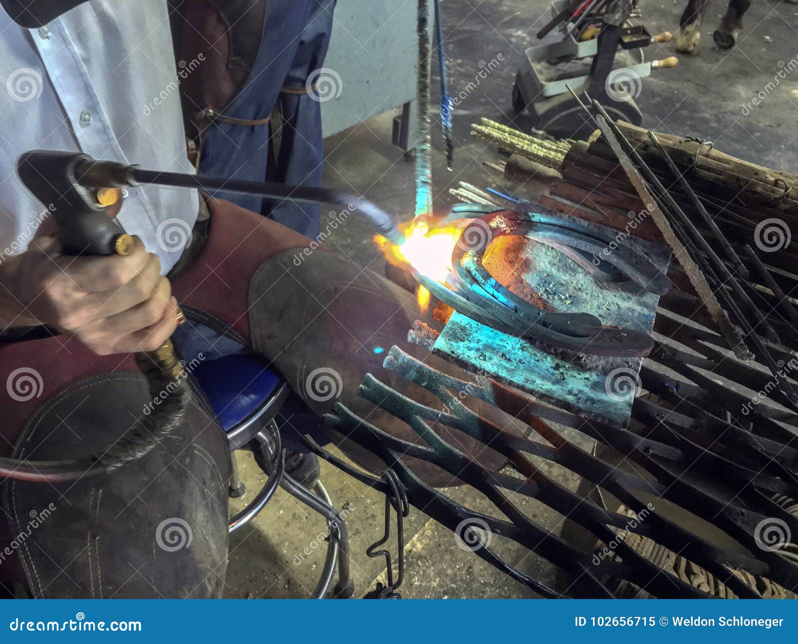 Blacksmith Working on Horseshoe Stock Image - Image of hand, flame ...