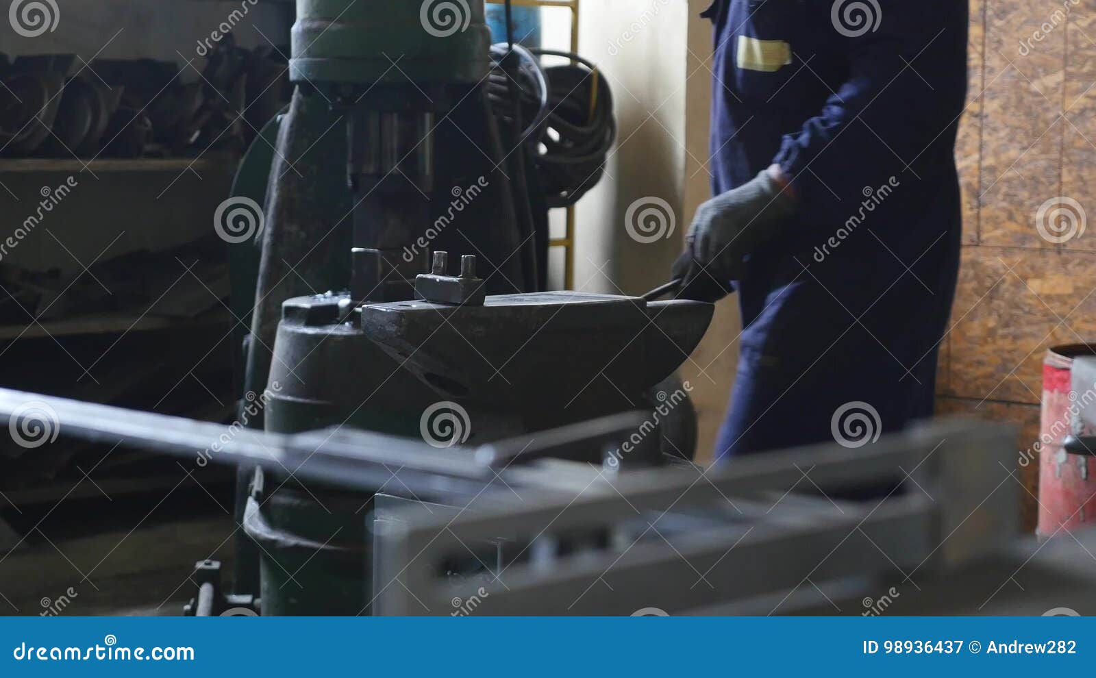 Blacksmith Working with Hot Glowing Metal, Bending Steel in a Smithery ...