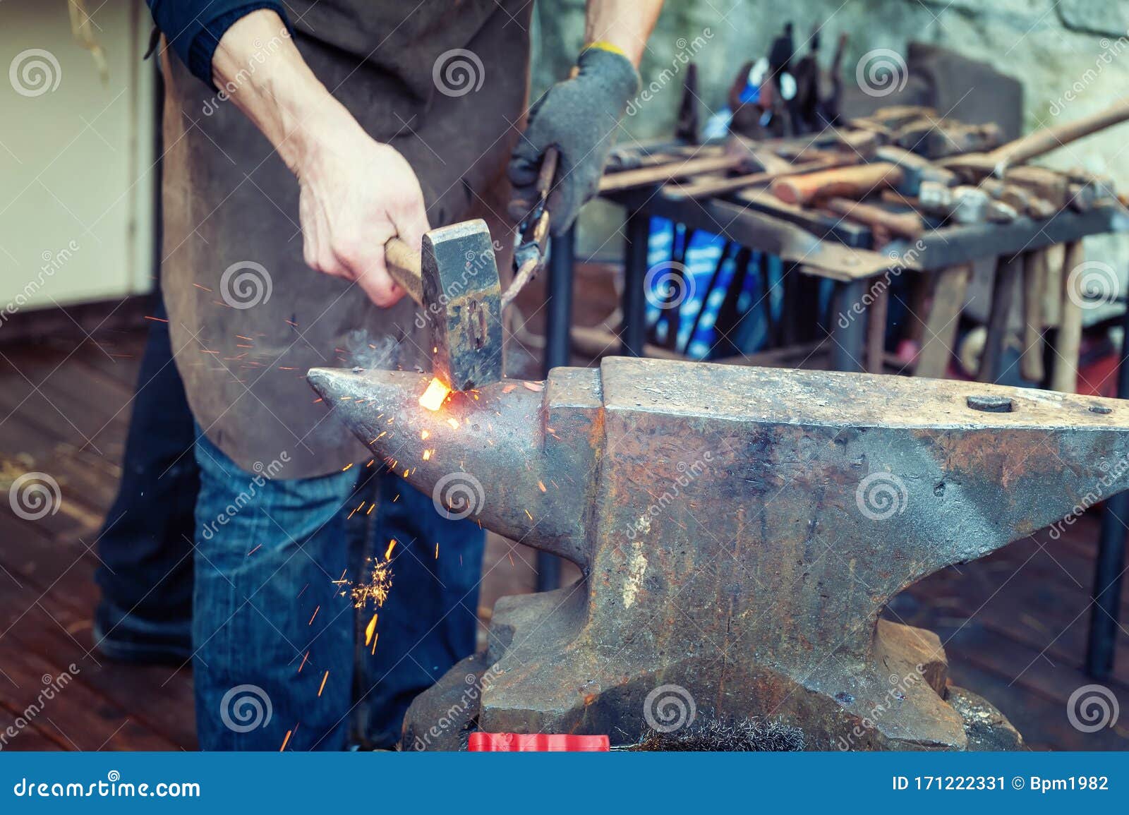 Blacksmith Working Metal with Hammer on the Anvil Stock Image - Image ...