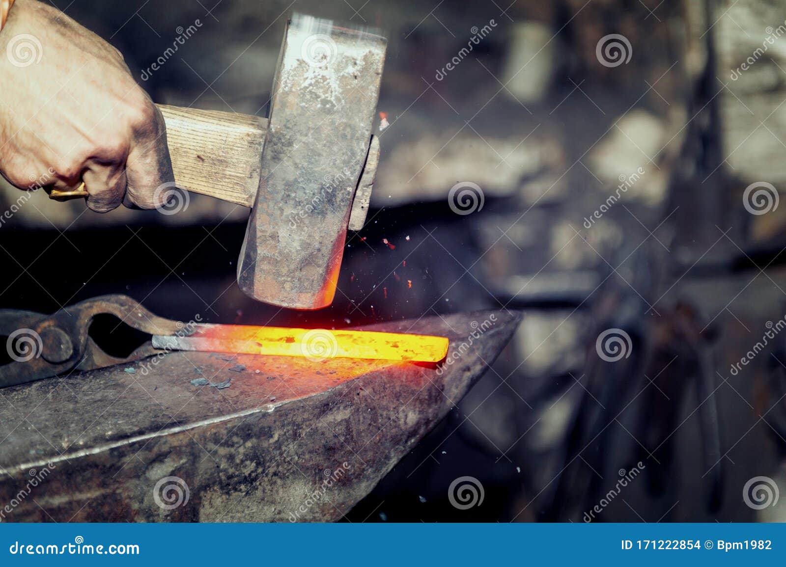 Blacksmith Working Metal with Hammer on the Anvil Stock Photo - Image ...