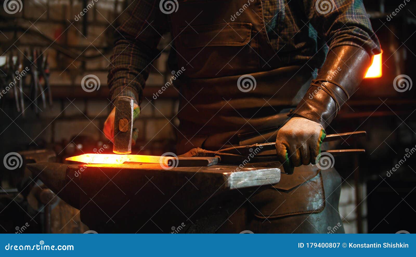 Blacksmith Working in the Workshop - Man Hitting the Hot Red Metal with ...