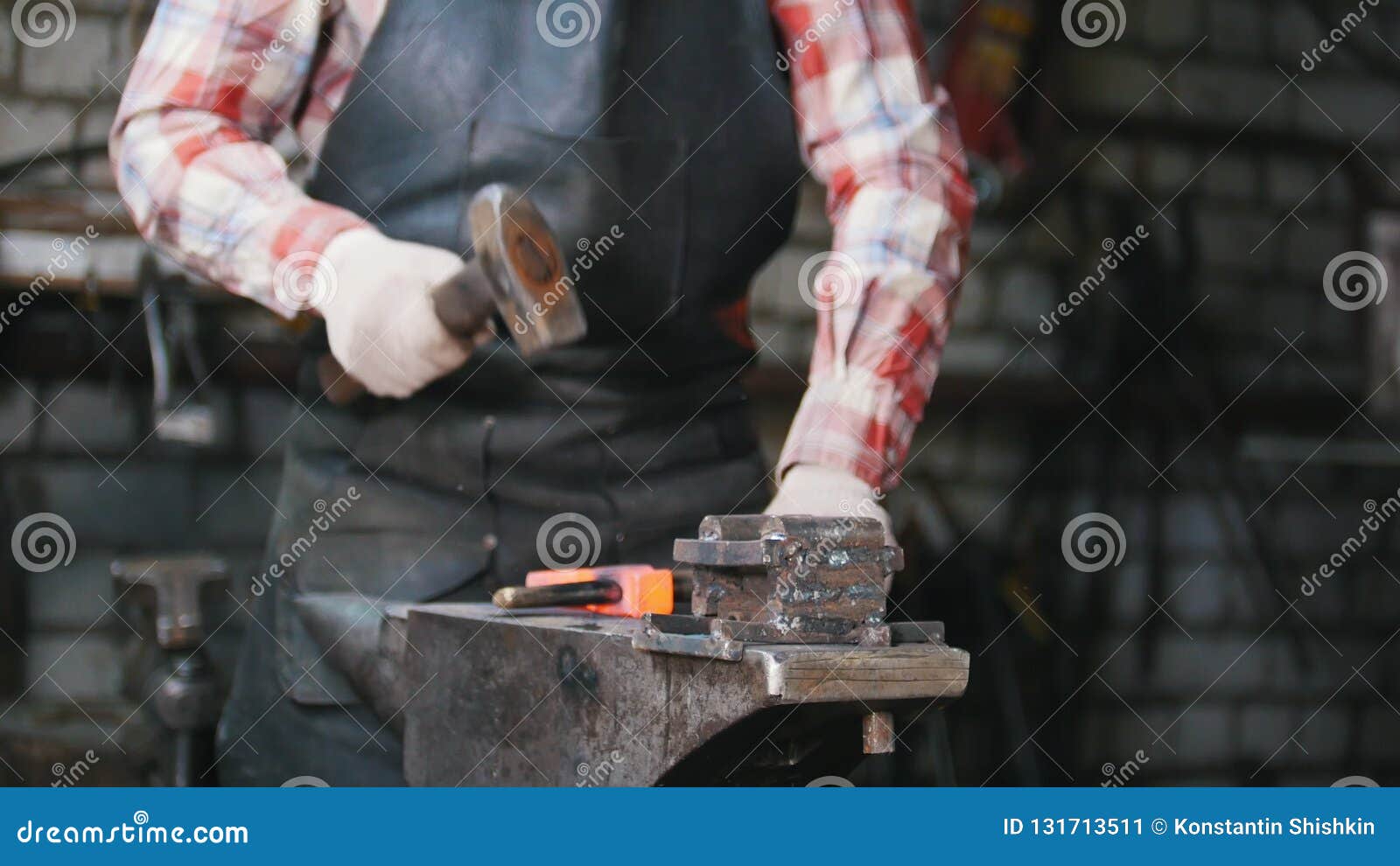 Blacksmith Workroom. Making a Perfect Form Detail Using a Hammer and a ...