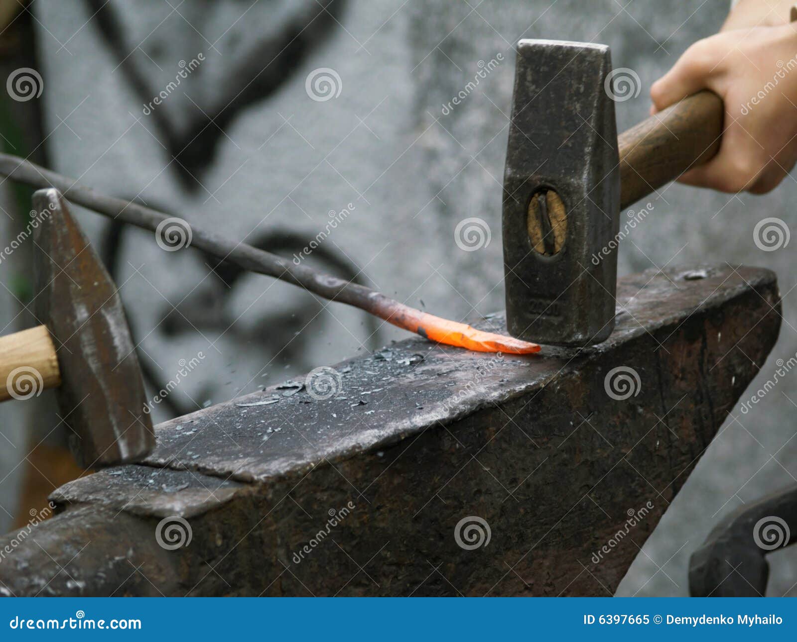 Blacksmiths Working on a Metal Detail. Artisan Blacksmith Forging Hot ...