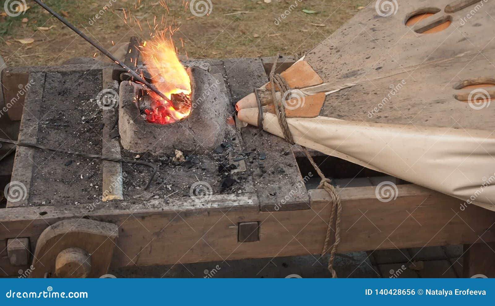Blacksmiths Working Old Fashioned Bellows at the Forge. the Blacksmith ...