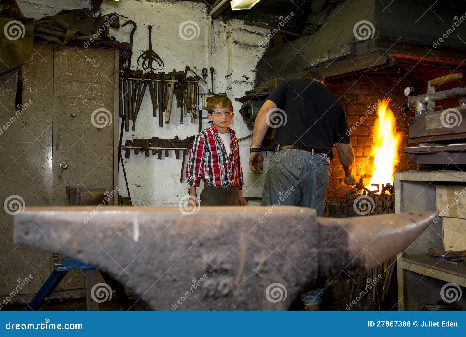 Blacksmiths with young son stock photo. Image of heat - 27867388