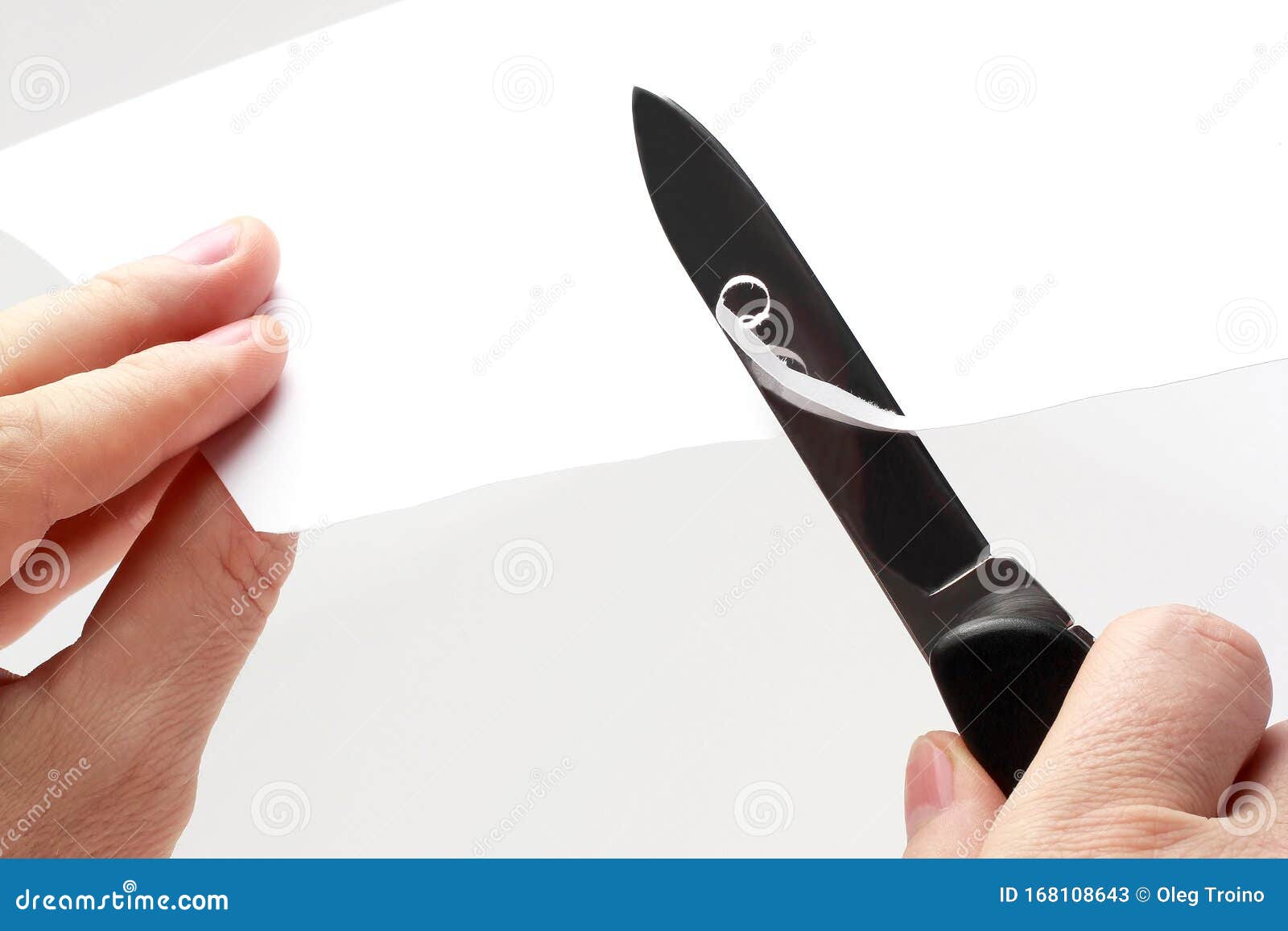 Blade of a Sharp Knife Cut Across the White Paper Stock Image - Image ...