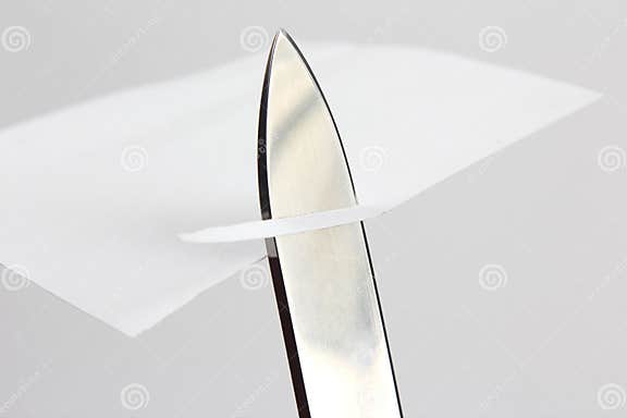 Blade of a Sharp Knife Cut Across the White Paper Stock Photo - Image ...