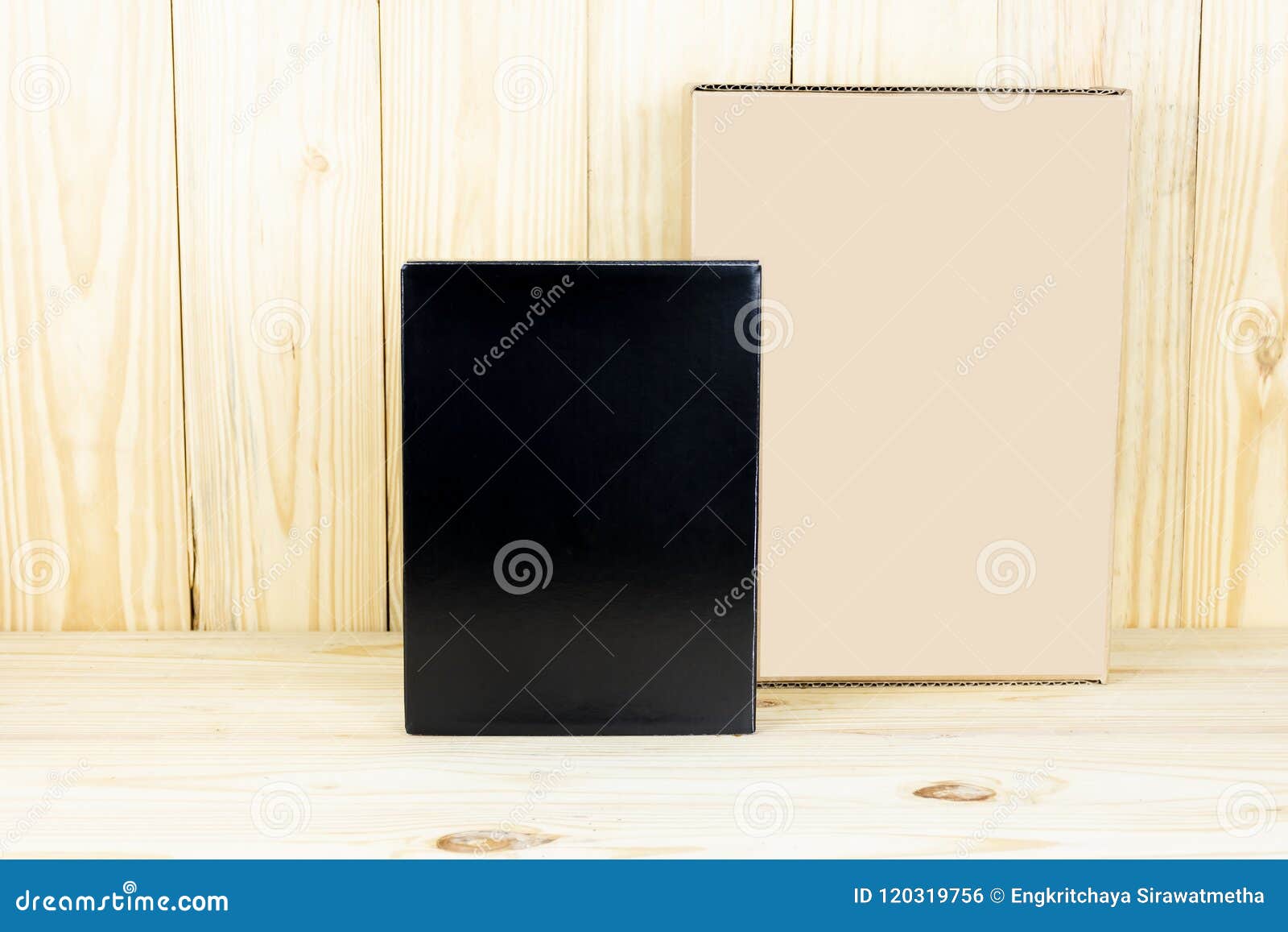 Blank Black Box and Blank Brown Box on Wooden Table.Zoom in and ...