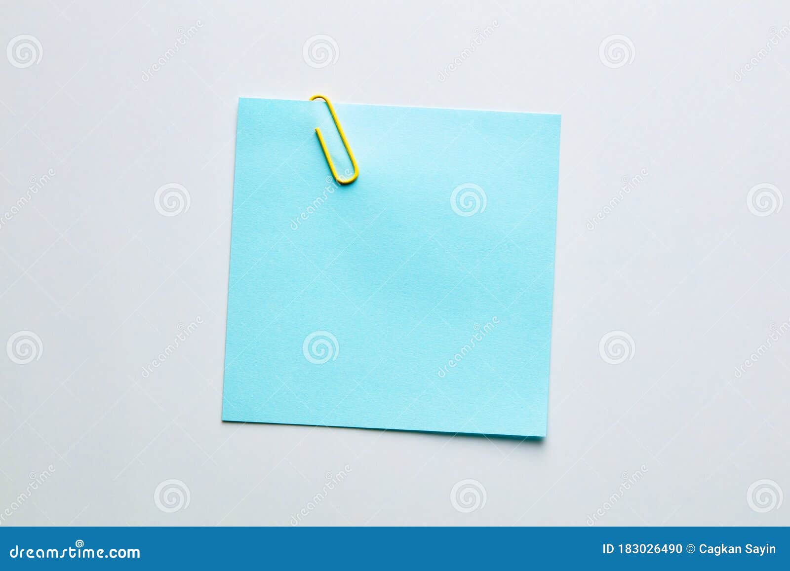 Blank Blue Note Paper or Notepad with a Yellow Paper Clip on White ...