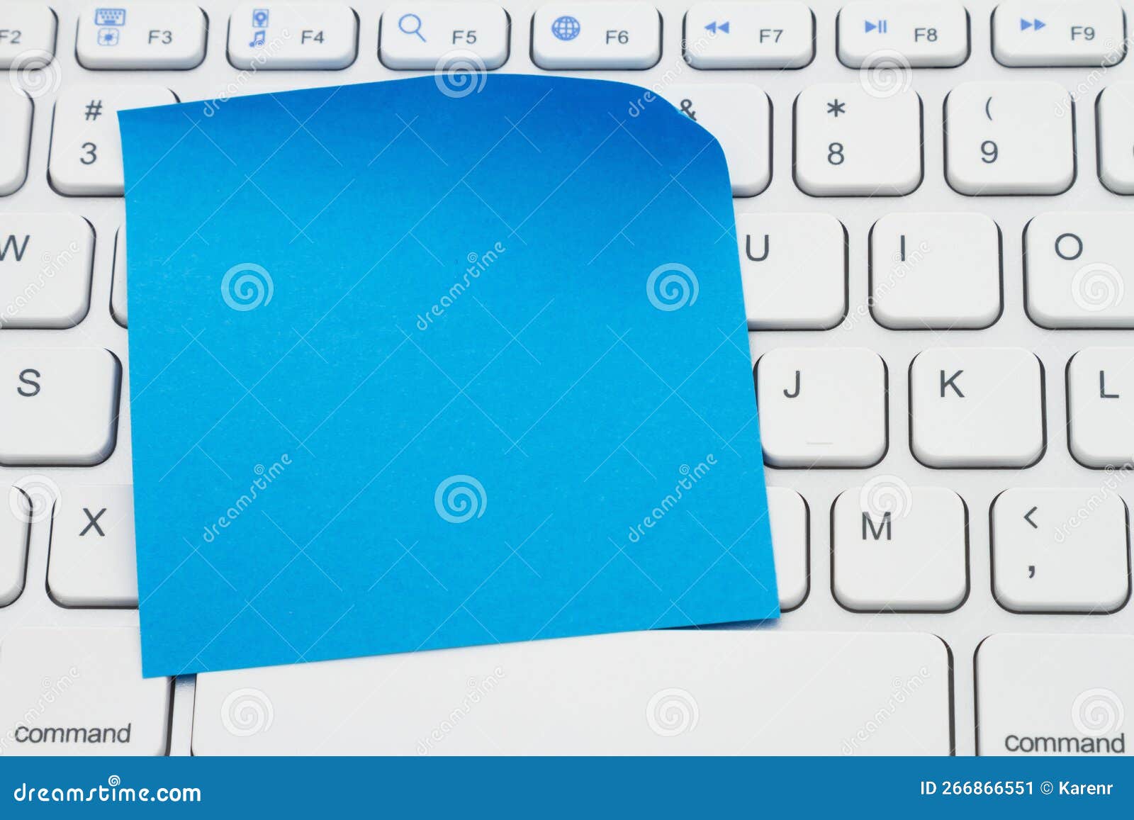 Blank Blue Sticky Note on a Profile Gray Computer Keyboard Stock Image ...
