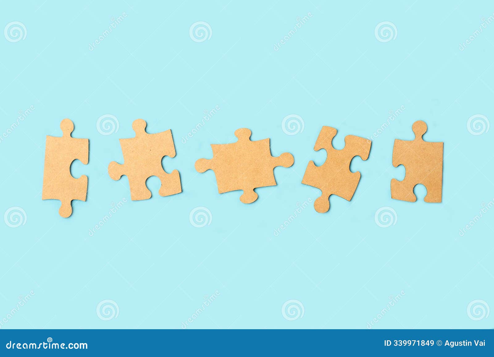 Blank Brown Puzzle Pieces on a Light Blue Background with Copy Space ...