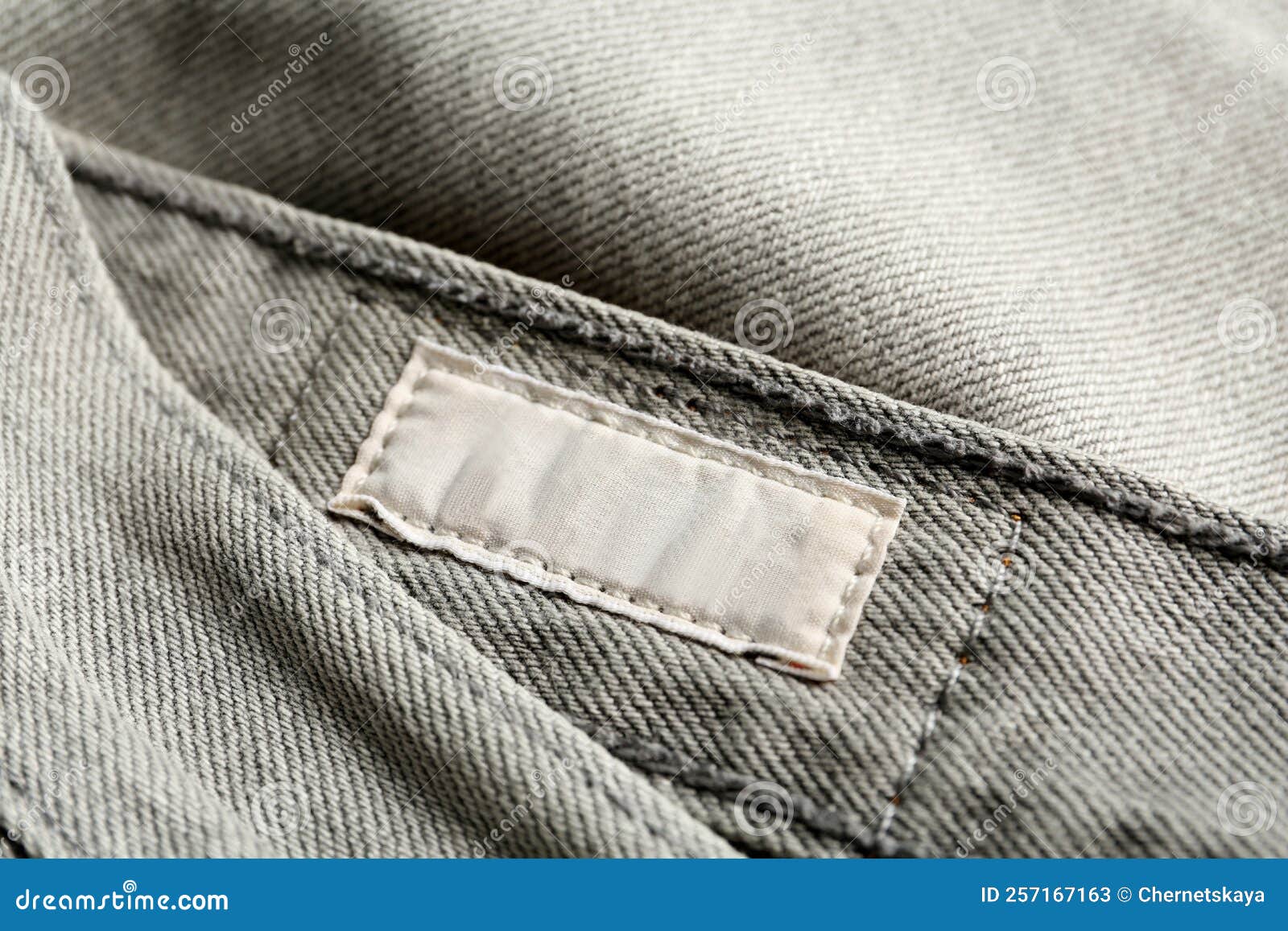 Blank Clothing Label on Grey Jeans, Closeup Stock Image - Image of ...