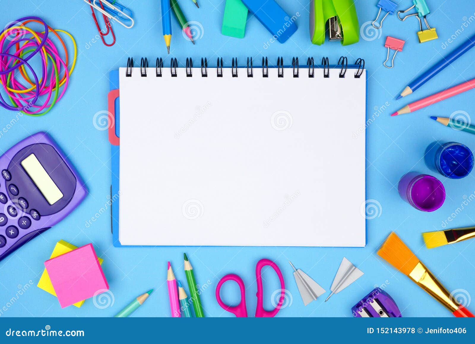 Blank Notebook with School Supplies Frame Against a Blue Background ...