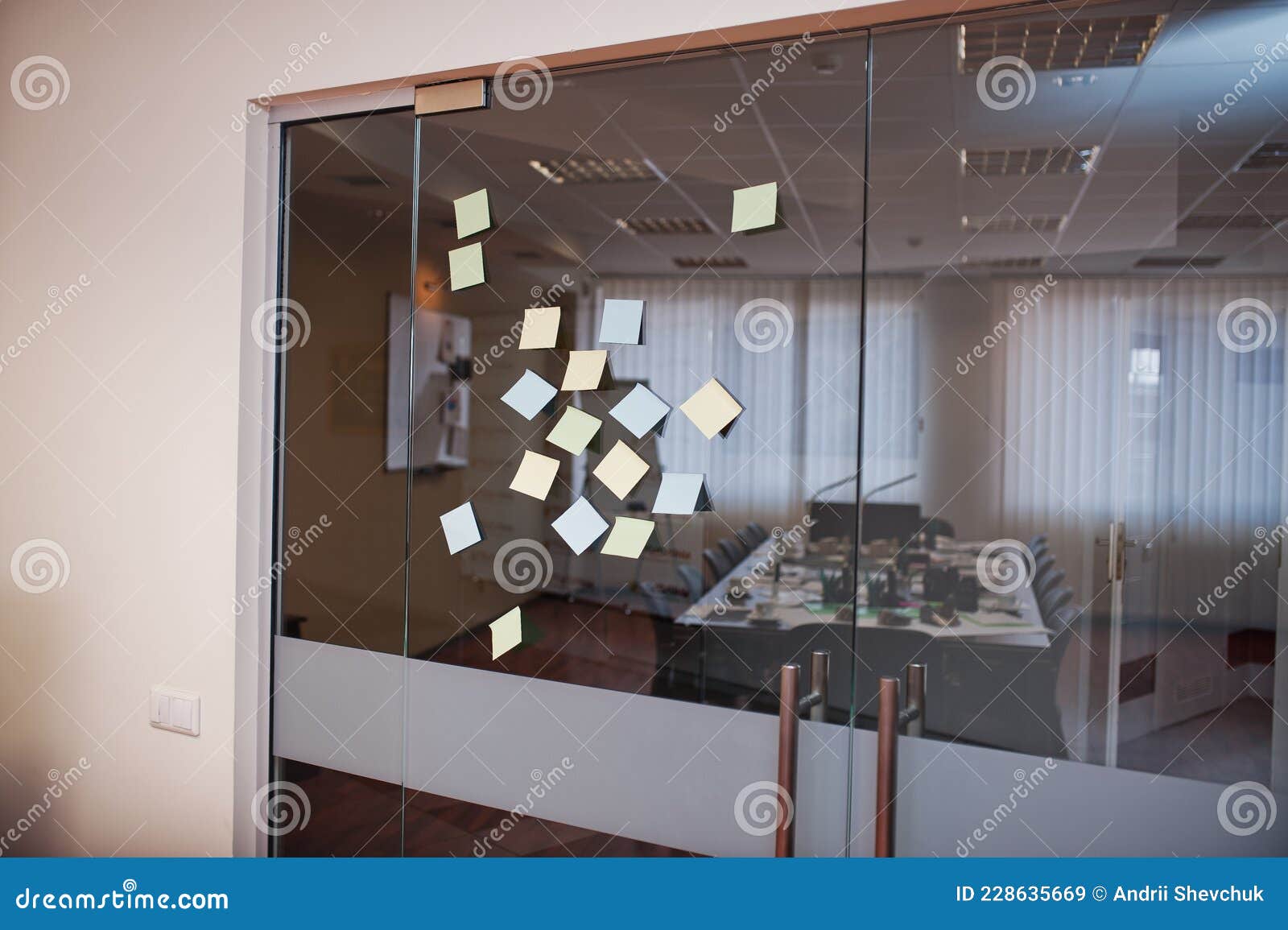 Blank Colored Sticky Note or Post Note Stuck on Glass Wall at Office ...
