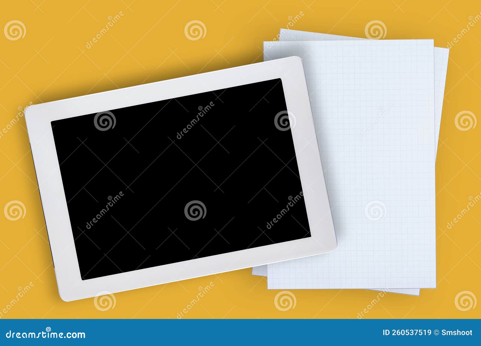 Blank or Empty Computer Digital Tablet and White Grid Paper on Yellow ...