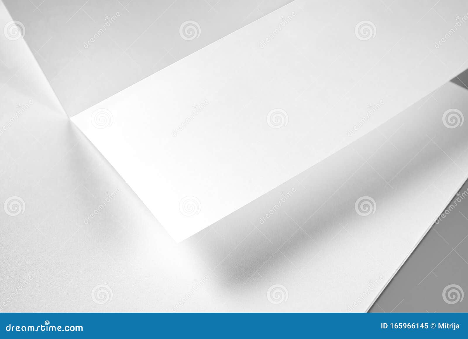 Blank Folded Sheet Of Paper, Flyer, Or Letterhead Over Stack Of Paper ...