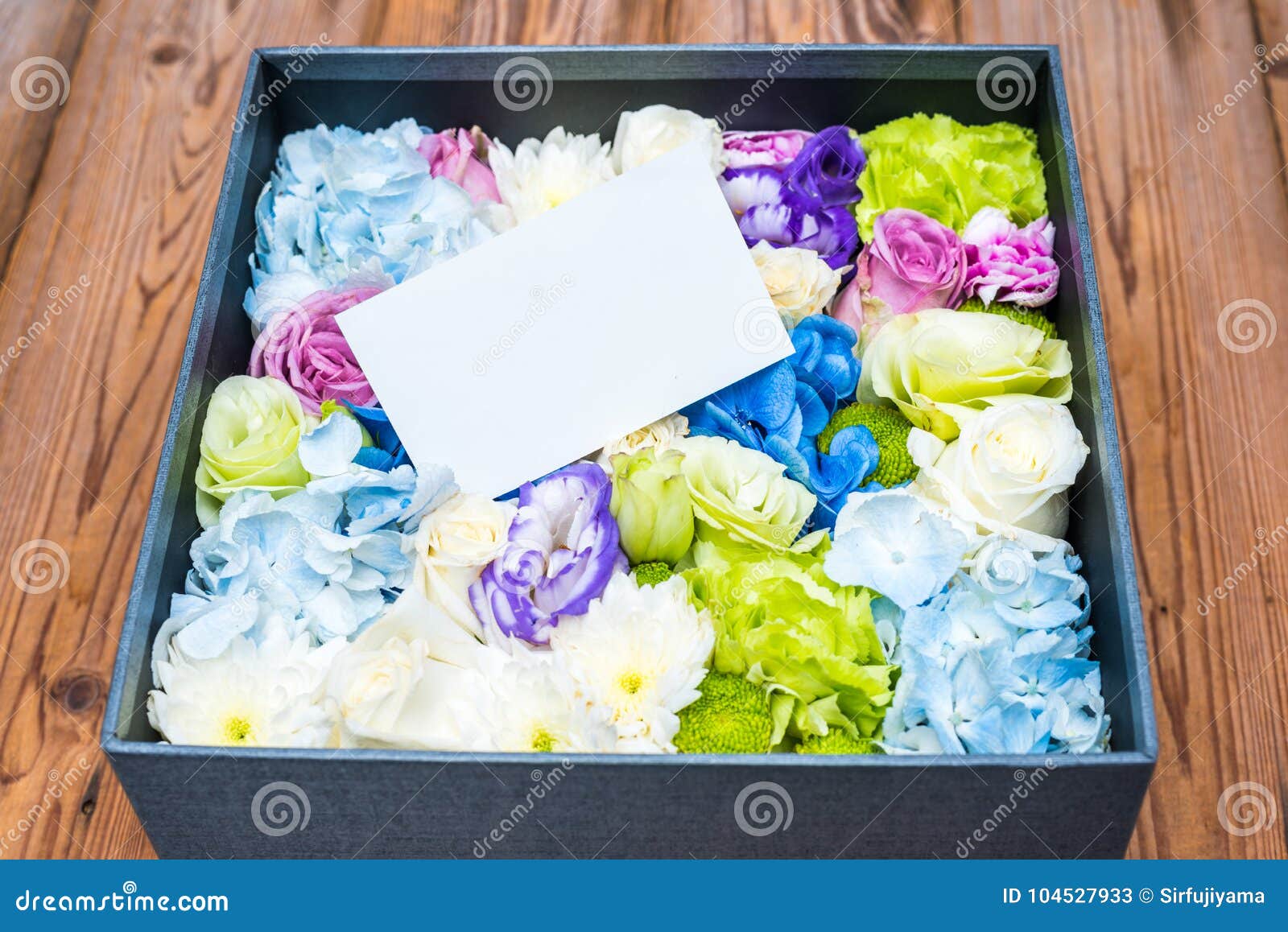 Blank note on flowers stock image. Image of present - 104527933