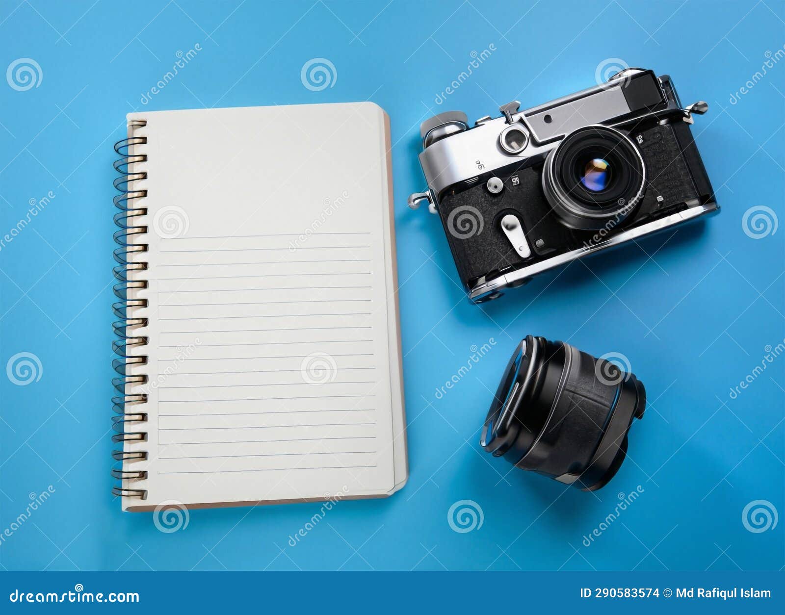 Blank Notebook with Camera and Lenses on Blue Background. Top View ...
