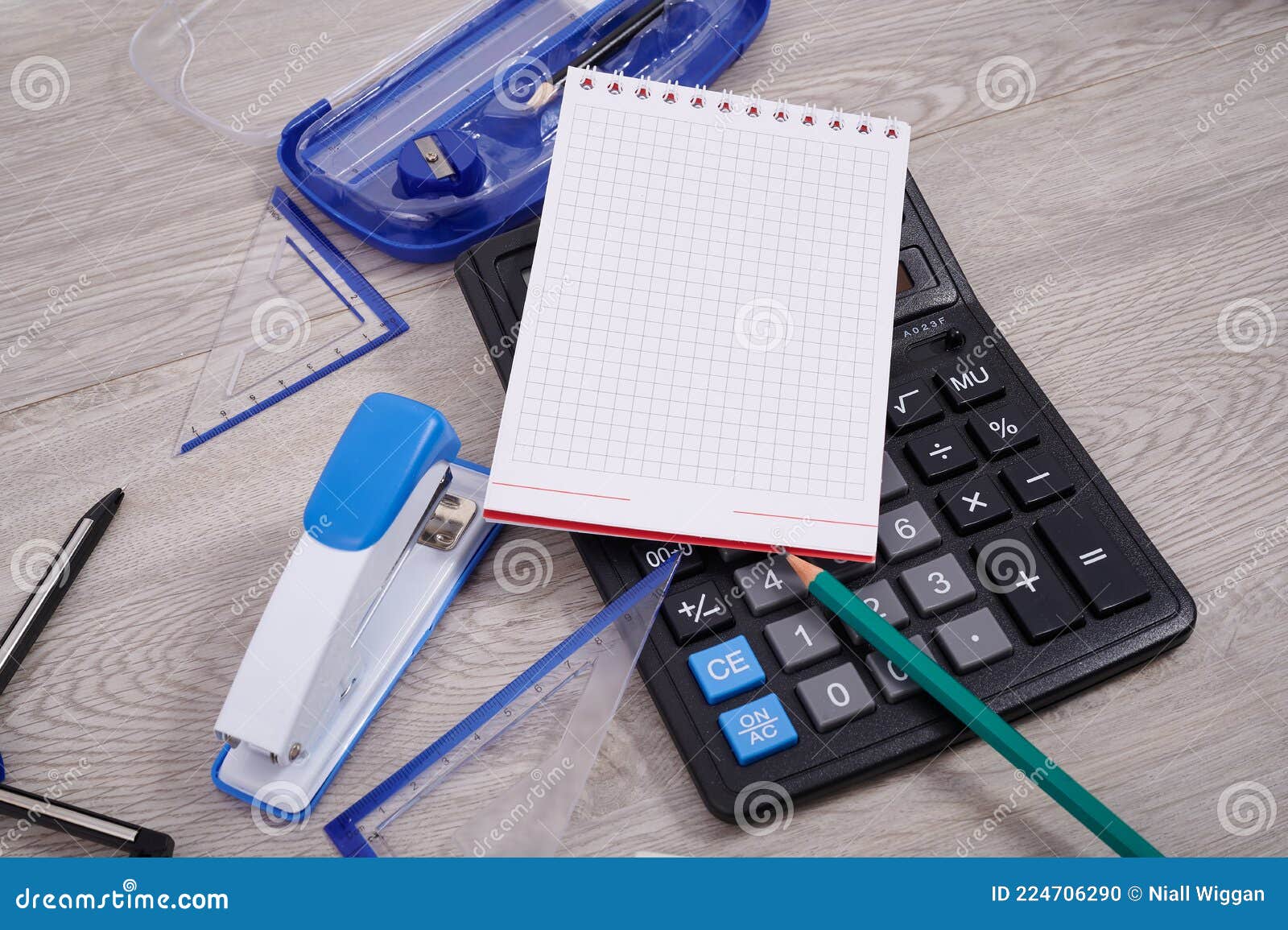 Blank Notebook Page with a Calculator and Geometric Stationery Sets on ...