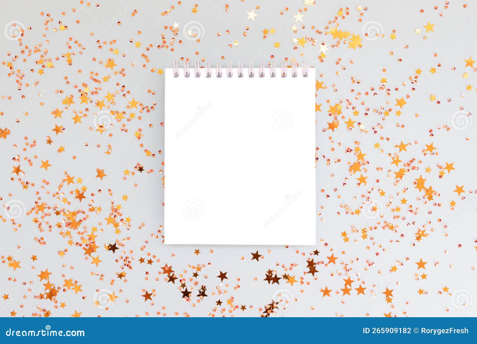 Blank Notepad Mockup and Gold Colored Stars Confetti. Stock Photo ...