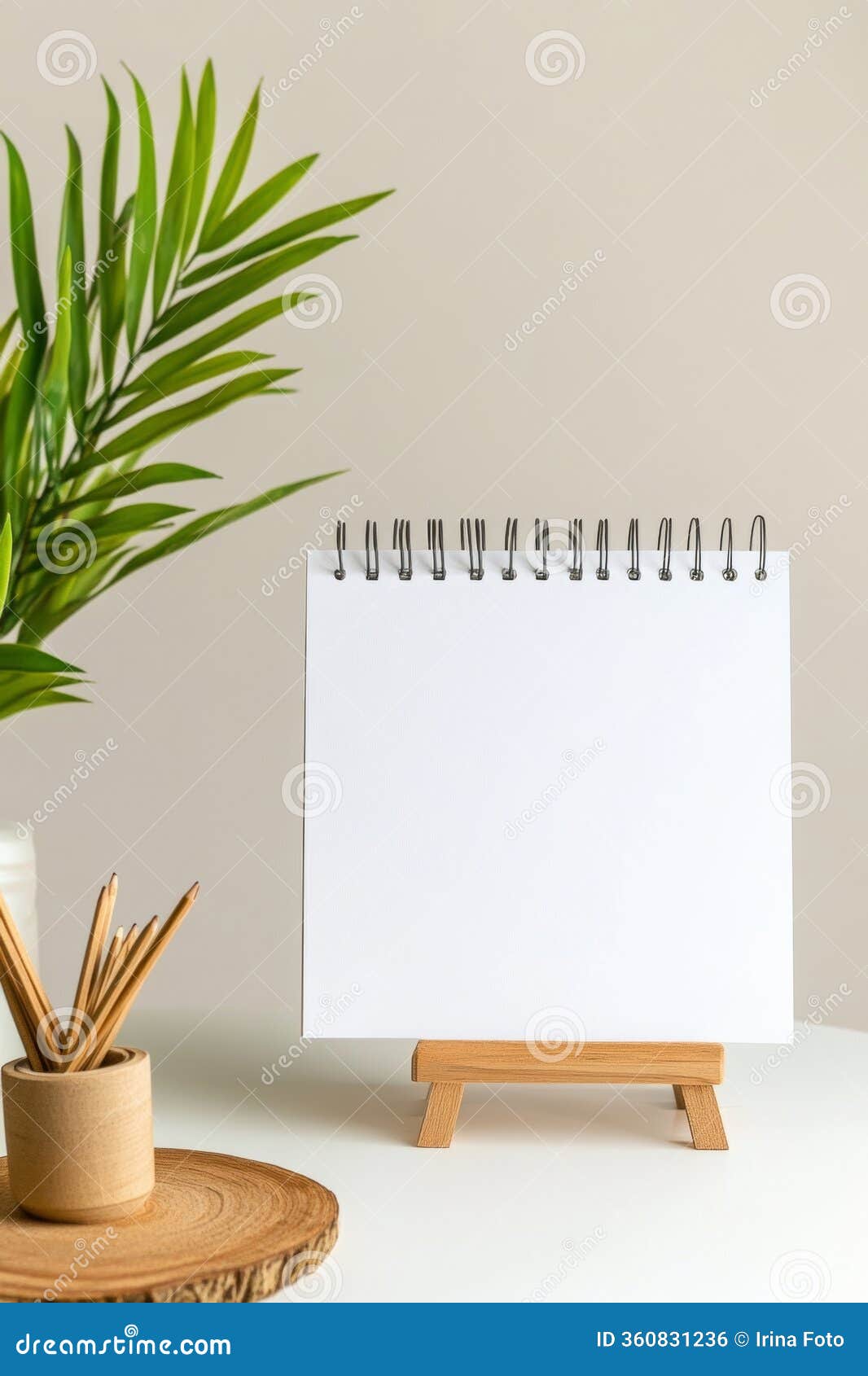 Blank Notepad on Stand with Plant and Stationery on a Light-colored ...