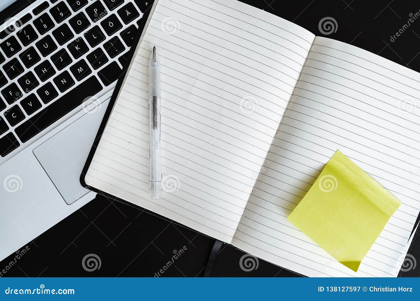 Blank Open Note Pad with Yellow Sticky Note Next To Laptop Computer ...