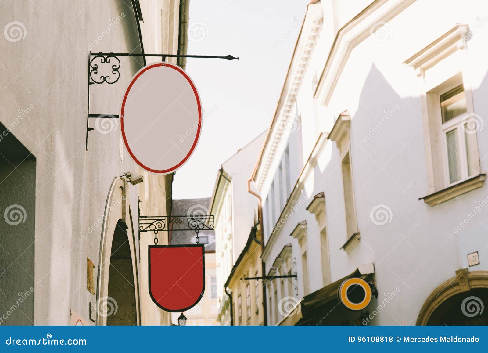 Blank Oval Signage Hanging from Wrought Iron Bracket Stock Photo ...