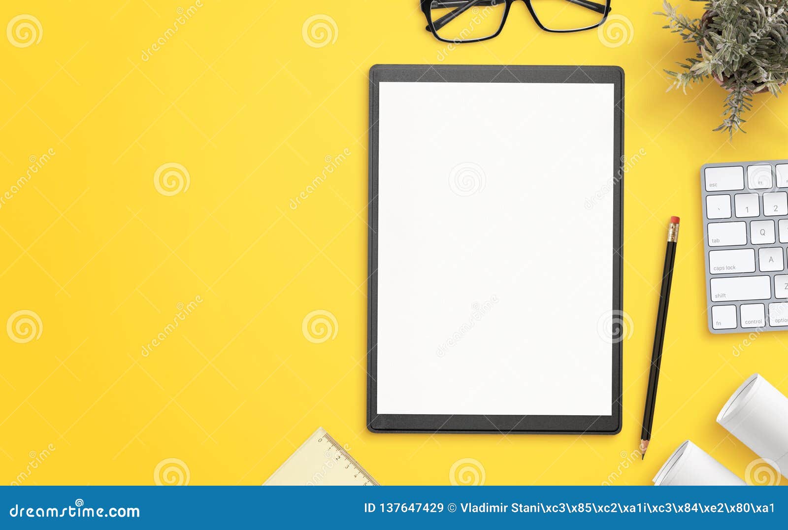 Blank Paper on Folder on Yellow Office Desk with Copy Space beside ...