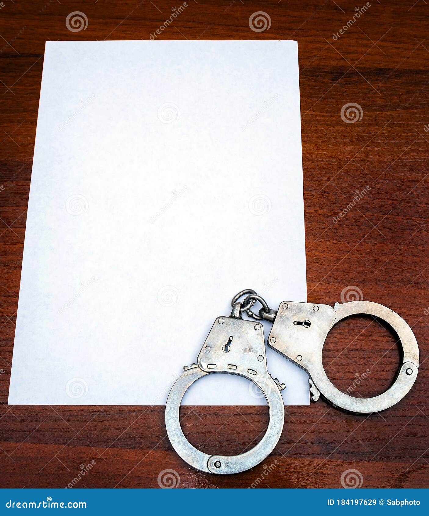 Blank Paper and Handcuffs stock image. Image of contract - 184197629