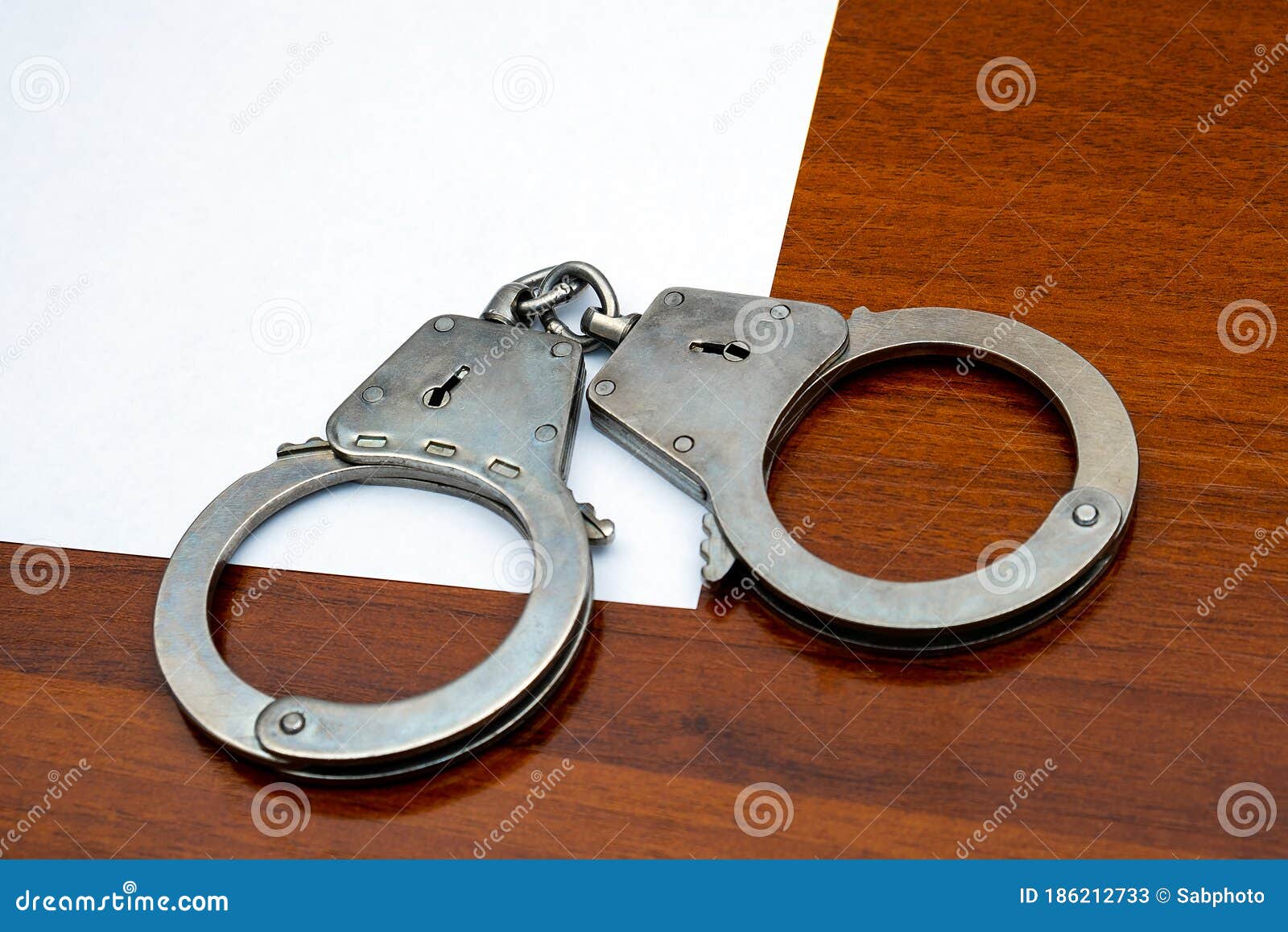 Blank Paper and Handcuffs stock image. Image of note - 186212733