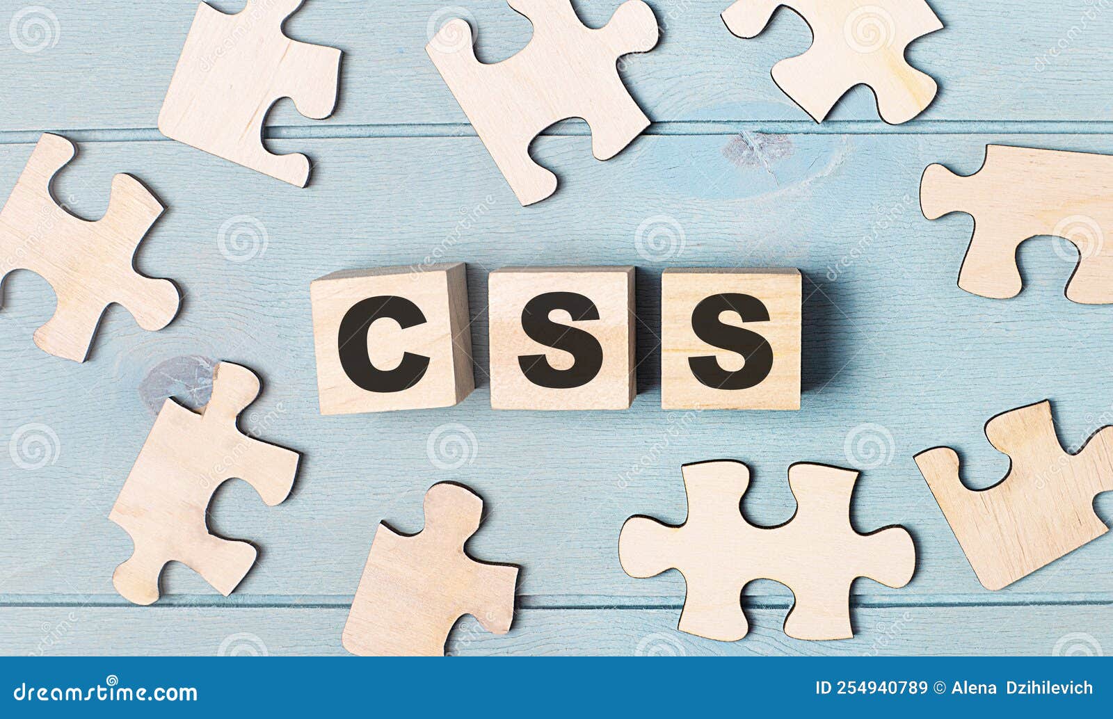 Blank Puzzles And Wooden Cubes With The Text Css Cascading Style Sheets Lie On A Light Blue