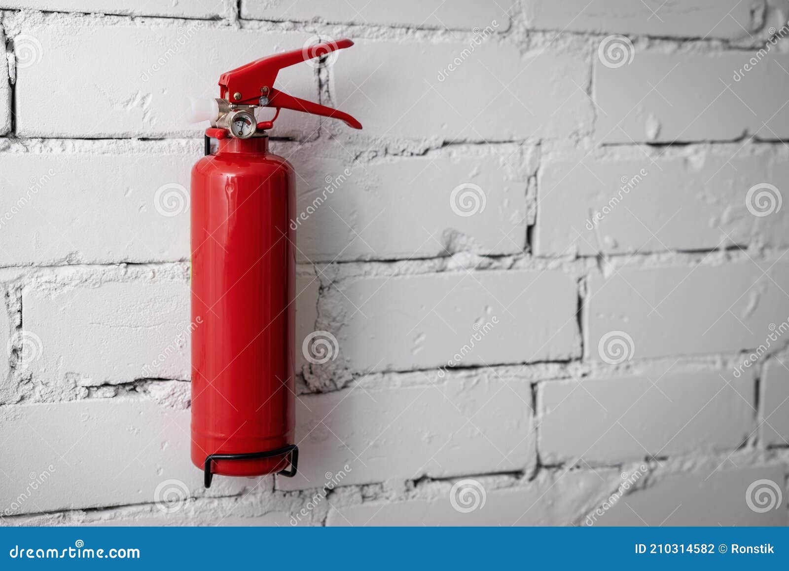 Red Fire Extinguisher Hanging on White Brick Wall. Copy Space Stock ...
