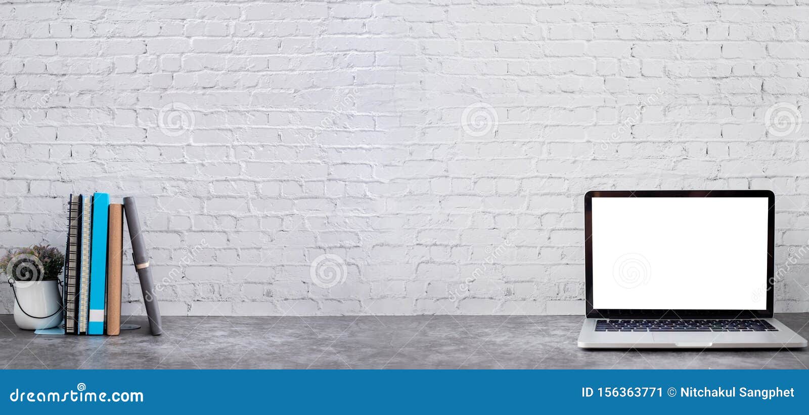 Blank Screen On Laptop With Books And Notebooks Paper On Brick Wall ...