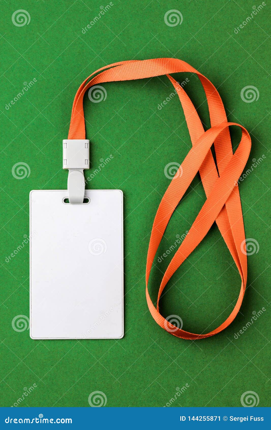 Blank Security Tag with a Red Stripe Neck on a Green Background. Place ...