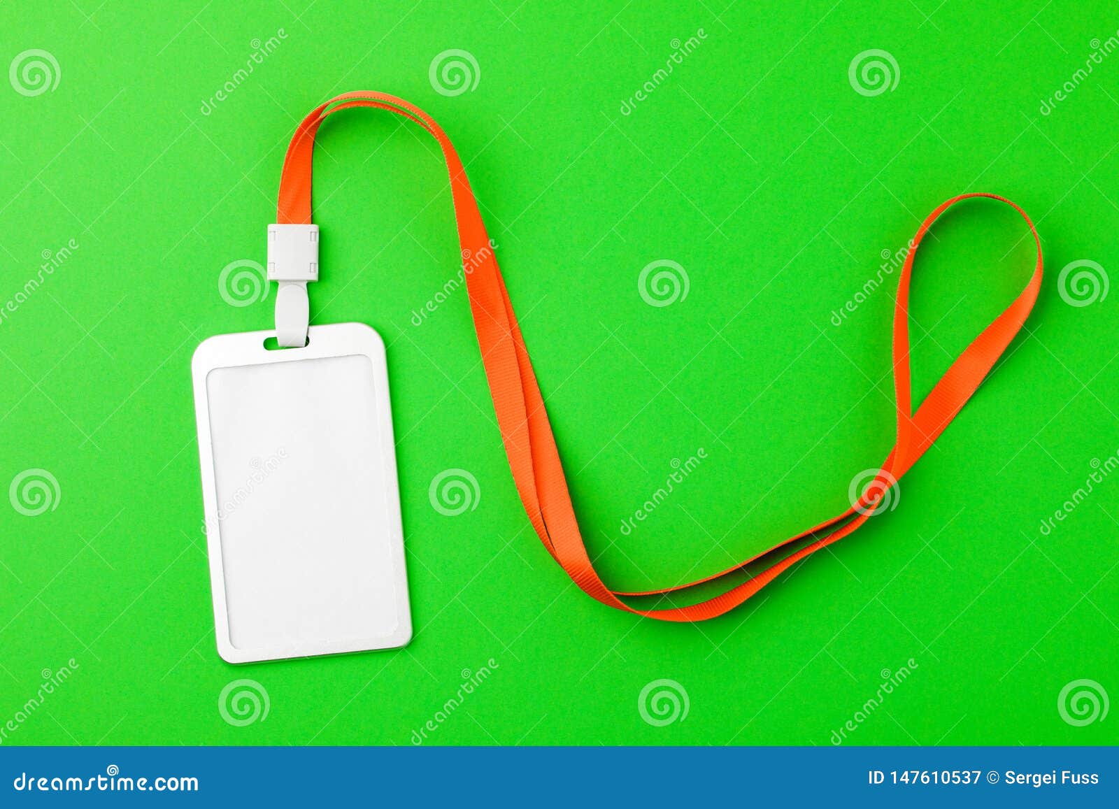 Blank Security Tag with a Red Stripe Neck on a Green Background. Place ...
