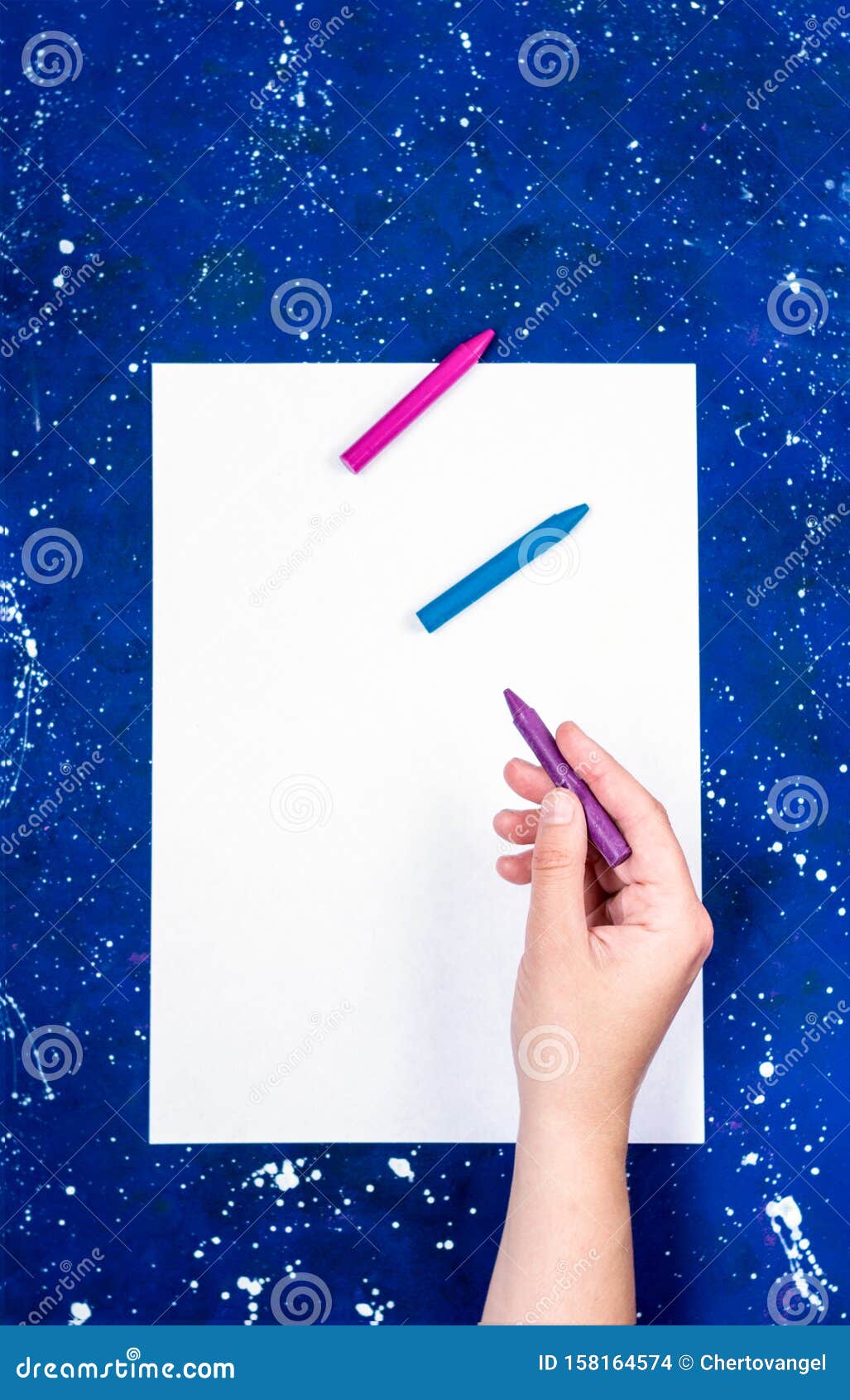 Blank Sheet of White Paper and Hand Hold Crayons on Galaxy-blue ... Blank Sheet of White Paper and Hand Hold Crayons on Galaxy-blue ...