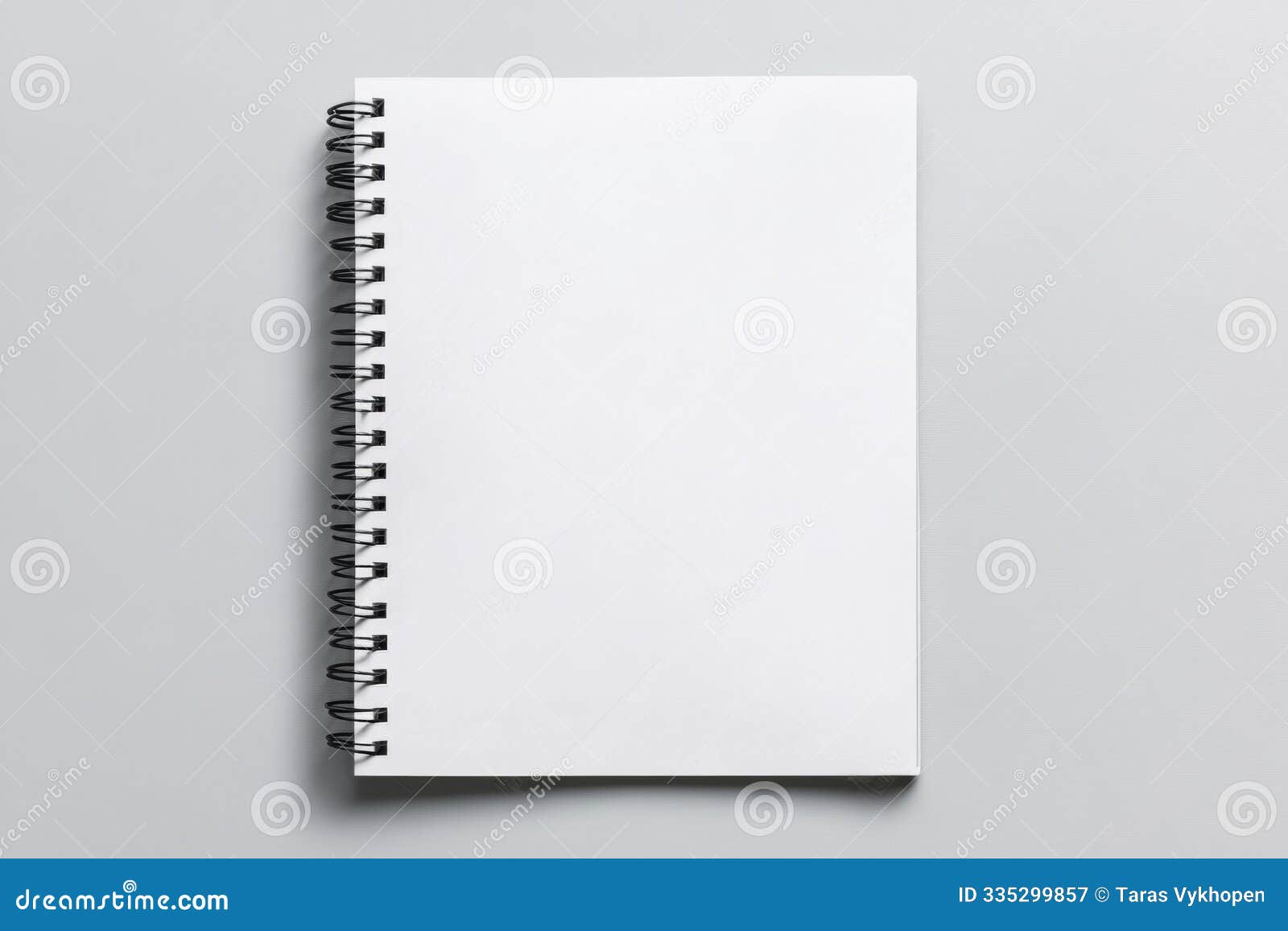 Blank Spiral Notebook on a Light Grey Surface for Creative Projects and ...
