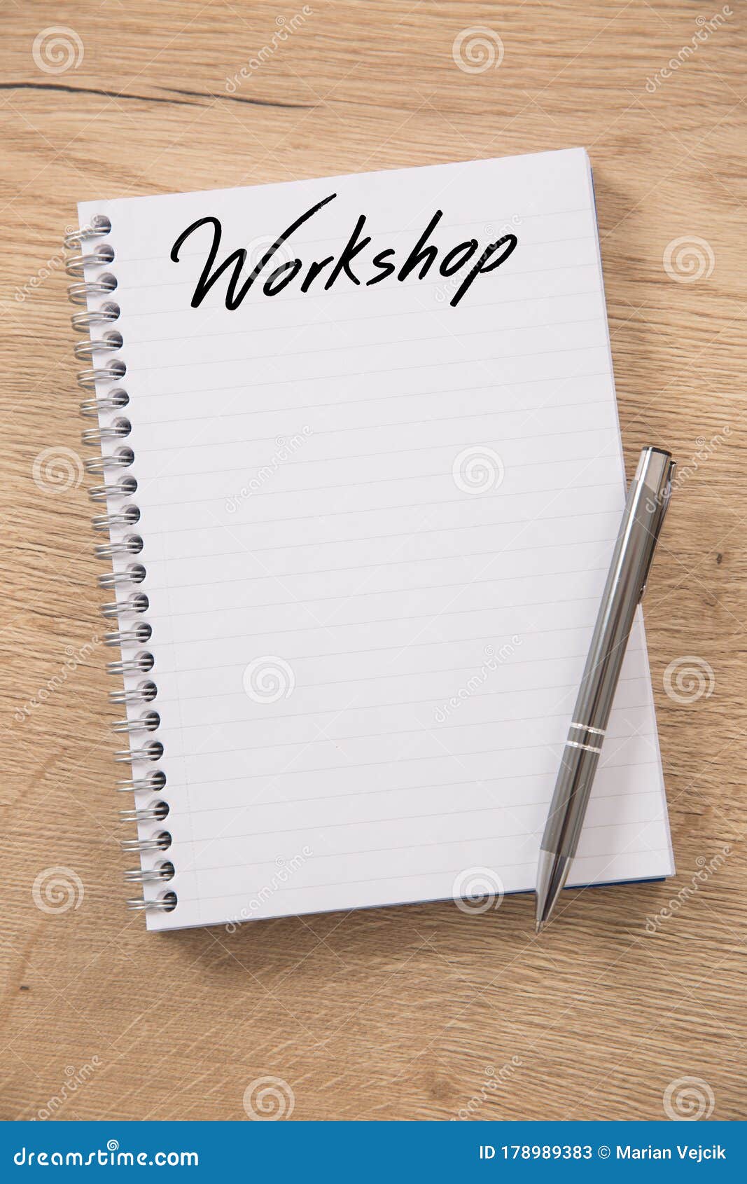 Blank Spiral Notebook with a Workshop Headline and Empty Lines Placed ...