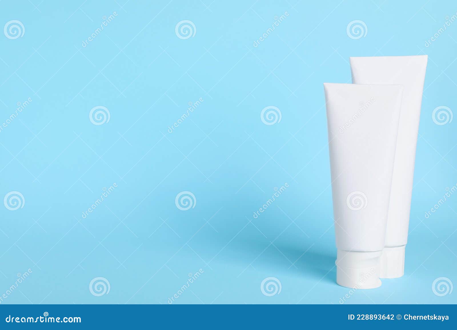 Blank Tubes of Toothpaste on Light Blue Background. Space for Text ...