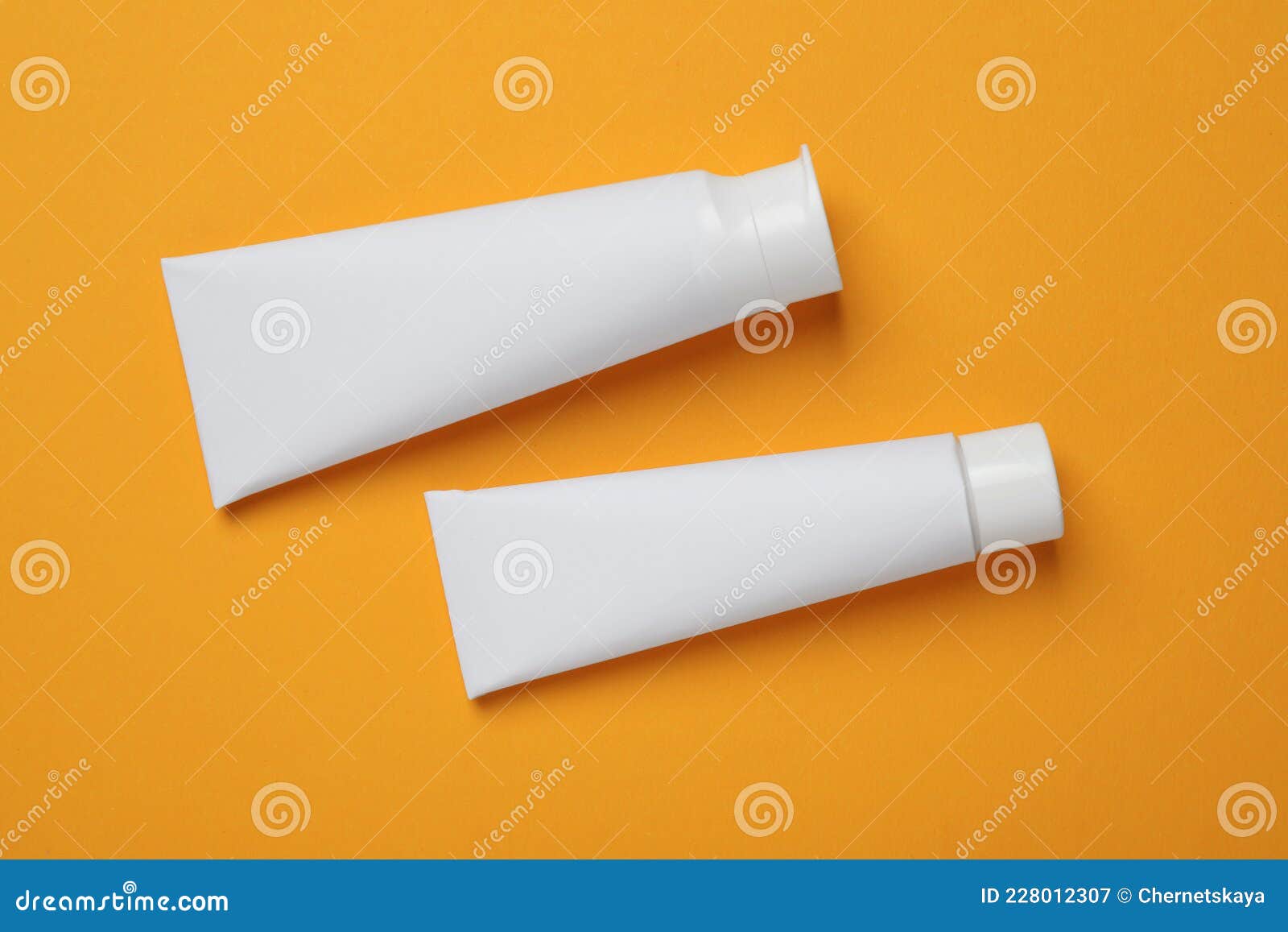 Blank Tubes of Toothpaste on Orange Background, Flat Lay Stock Image ...