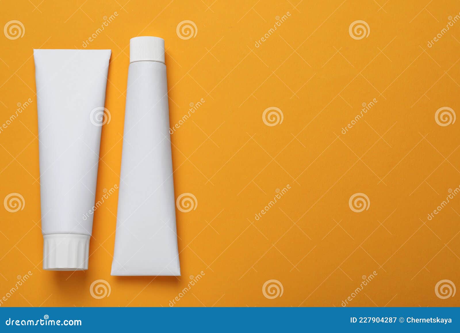 Blank Tubes of Toothpaste on Orange Background, Flat Lay. Space for ...