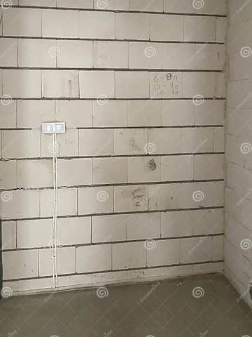 Blank Wall with Two Electrical Outlets, Empty Flat with Concrete Screed ...