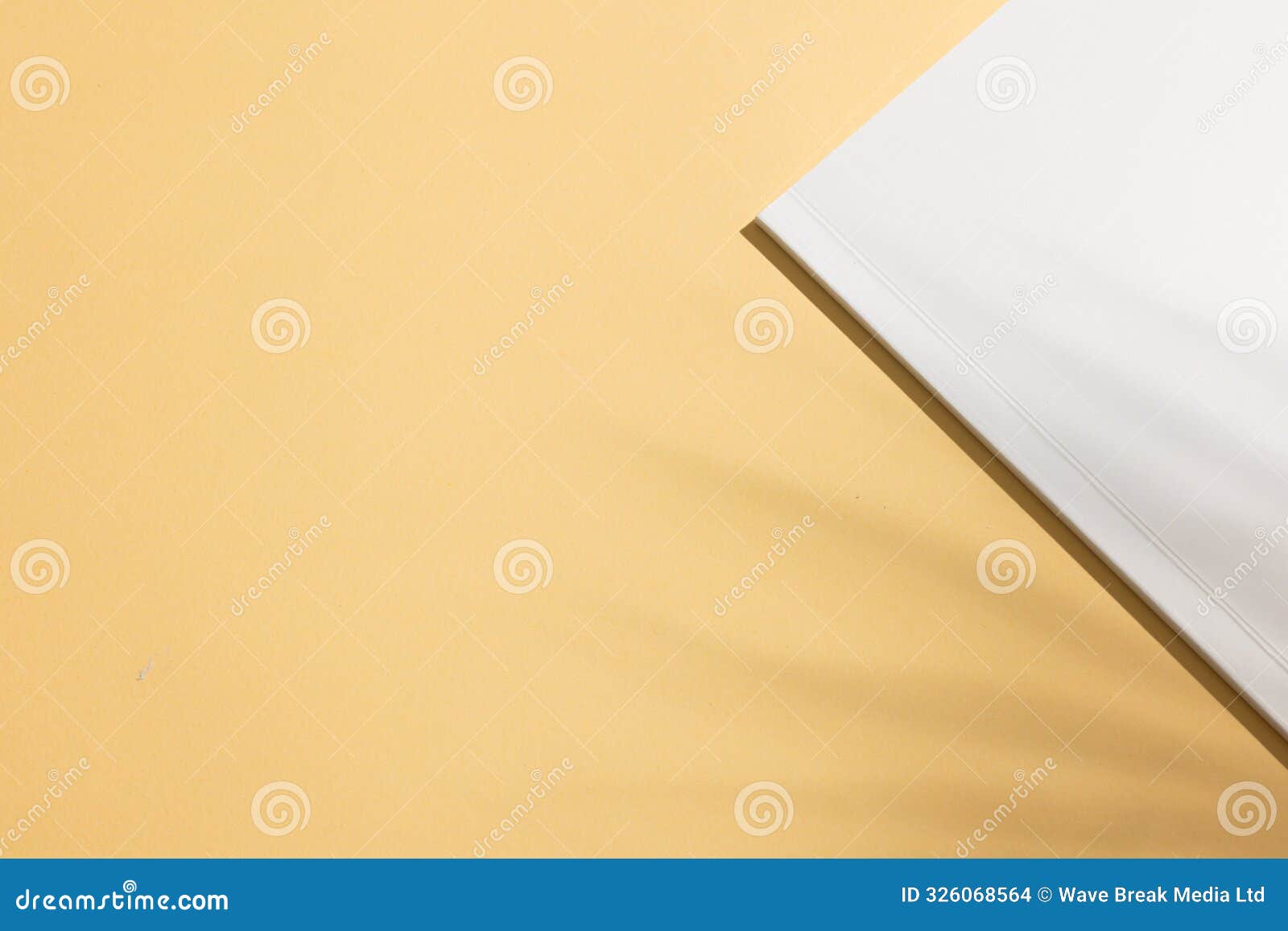 A Blank White Book on a Yellow Background, with Copy Space Stock Photo ...