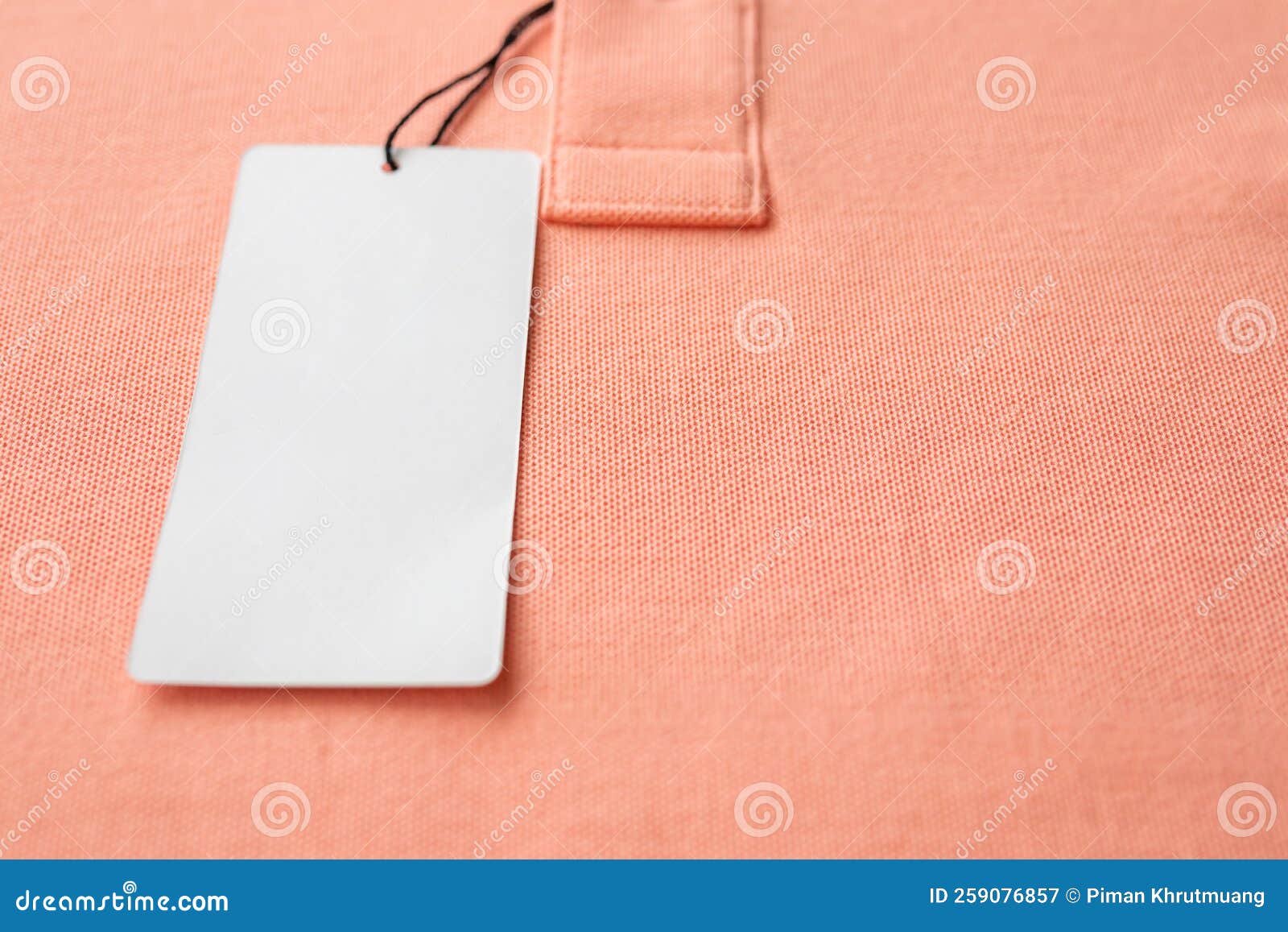 Blank White Clothes Tag Label on Pink Fabric Texture Background Stock ...