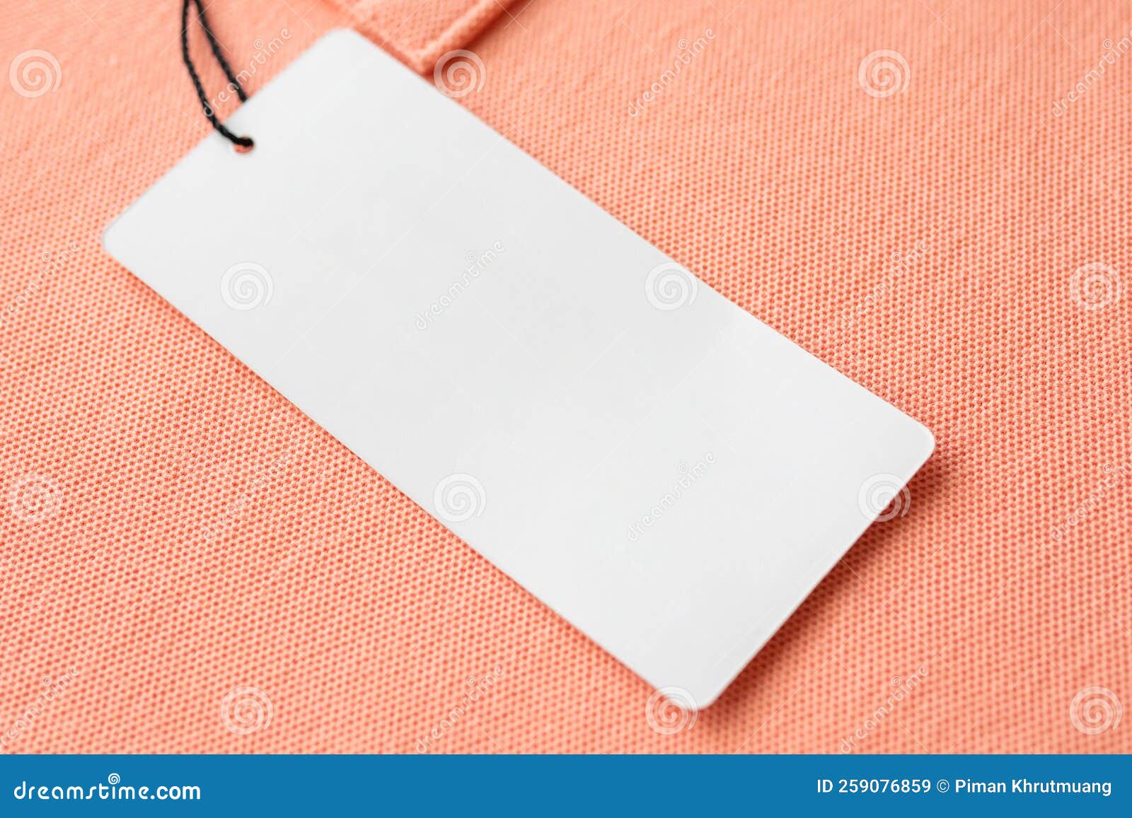 Blank White Clothes Tag Label on Pink Fabric Texture Background Stock ...