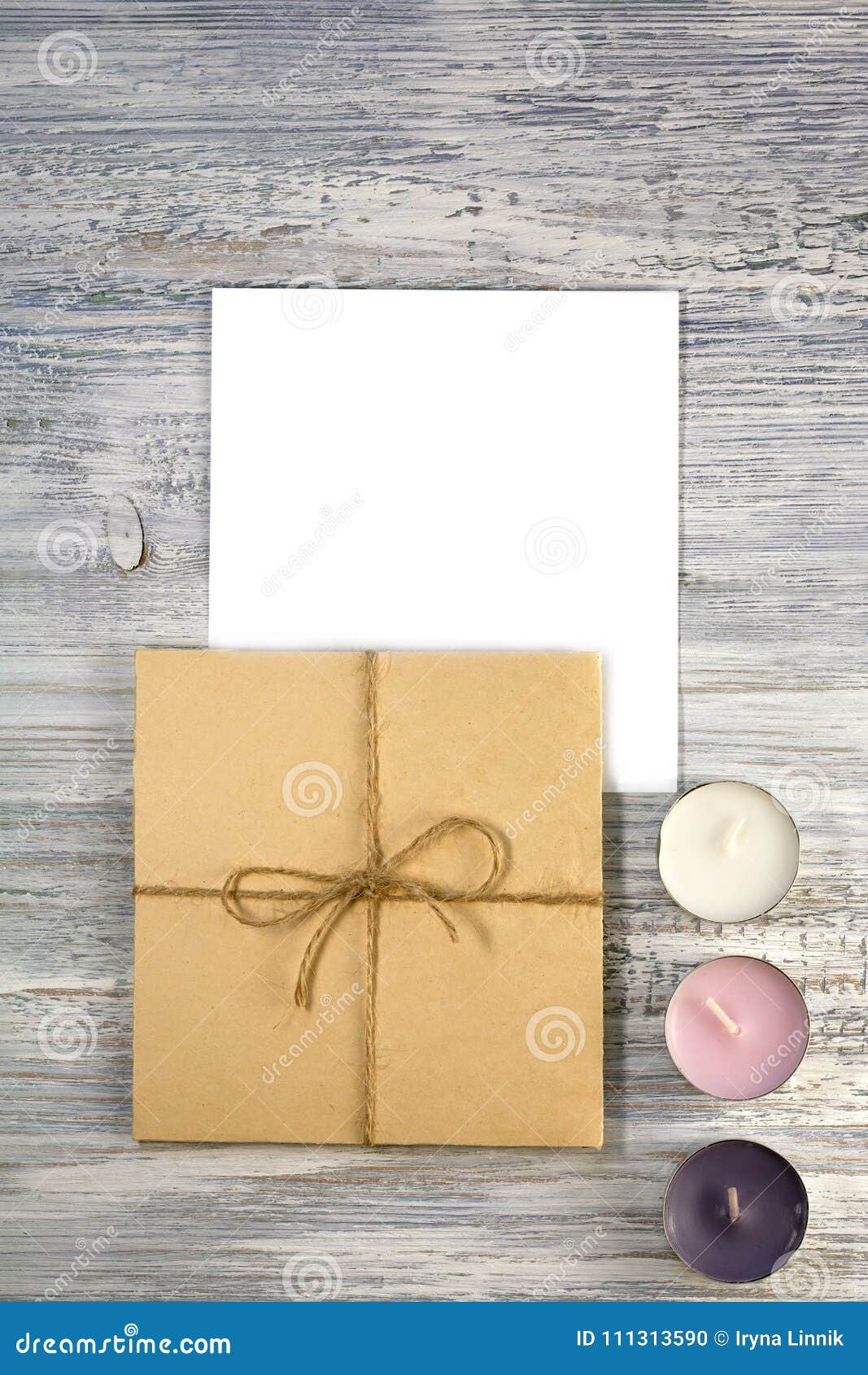 Blank White Greeting Card and Envelope with Candles Over Rustic Table ...