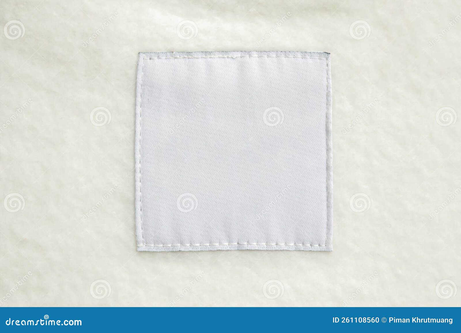Blank White Laundry Care Clothes Label on Fabric Texture Background ...