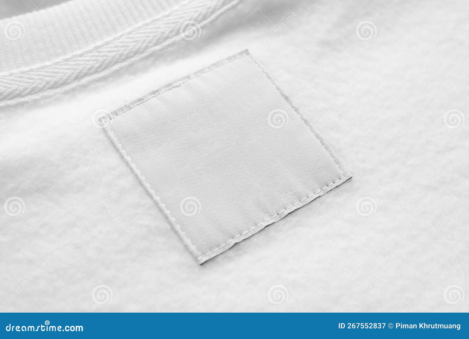 Blank White Laundry Care Clothes Label on Fabric Texture Background ...