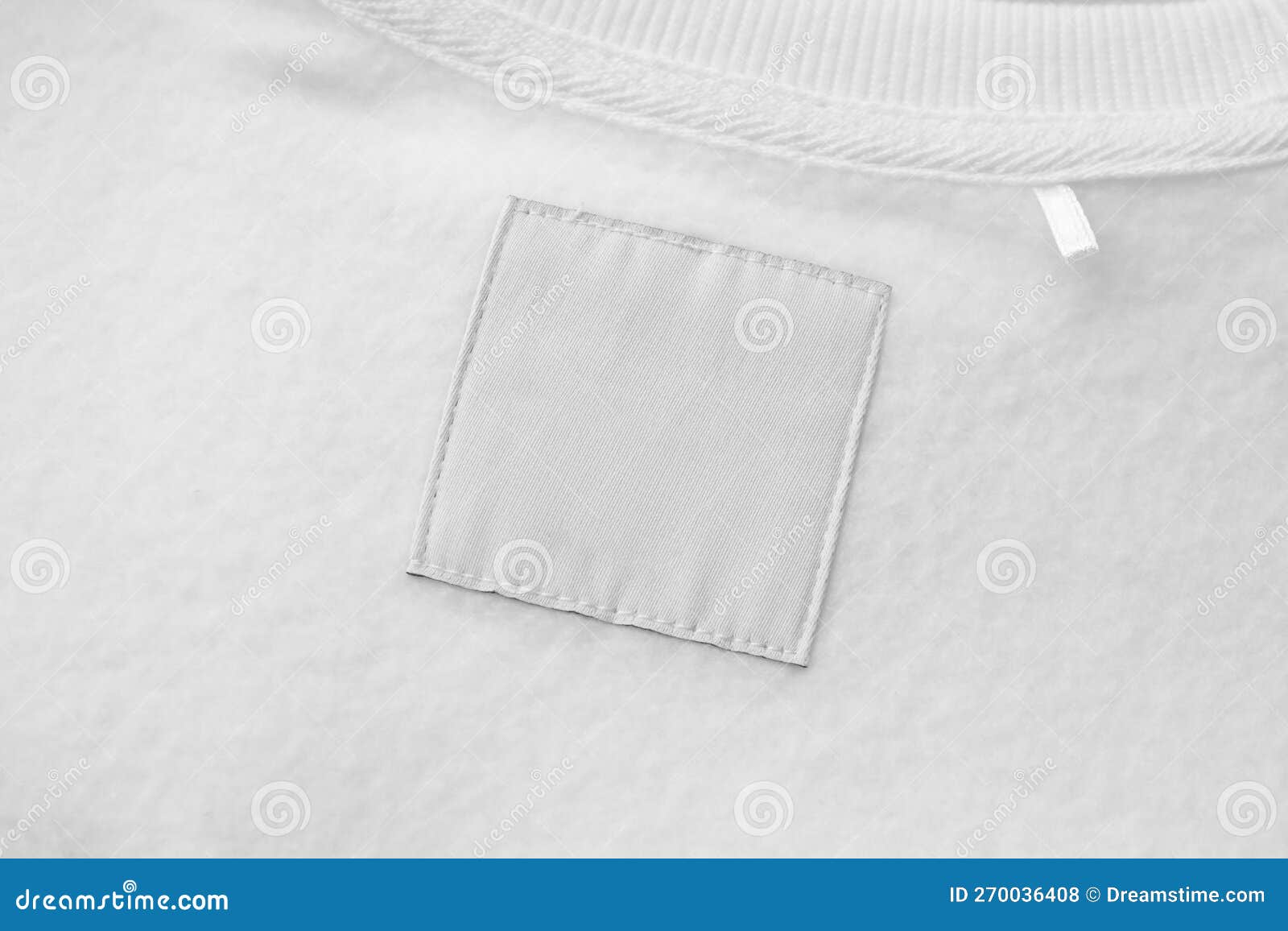 Blank White Laundry Care Clothes Label on Fabric Texture Background ...